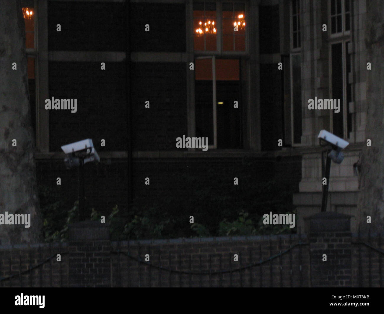 This image shows a CCTV camera in a public space in London, reflecting ...