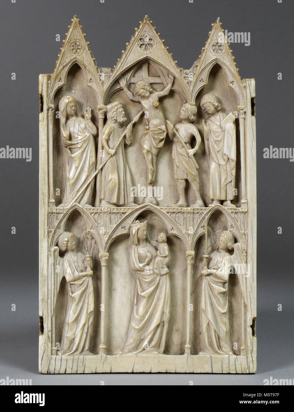 The Central Panel of a Triptych, housed at the Metropolitan Museum of Art, represents a ...