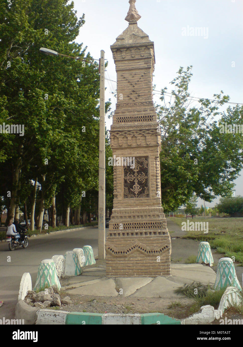 The image shows carved brick columns from the modern gates of Nishapur ...