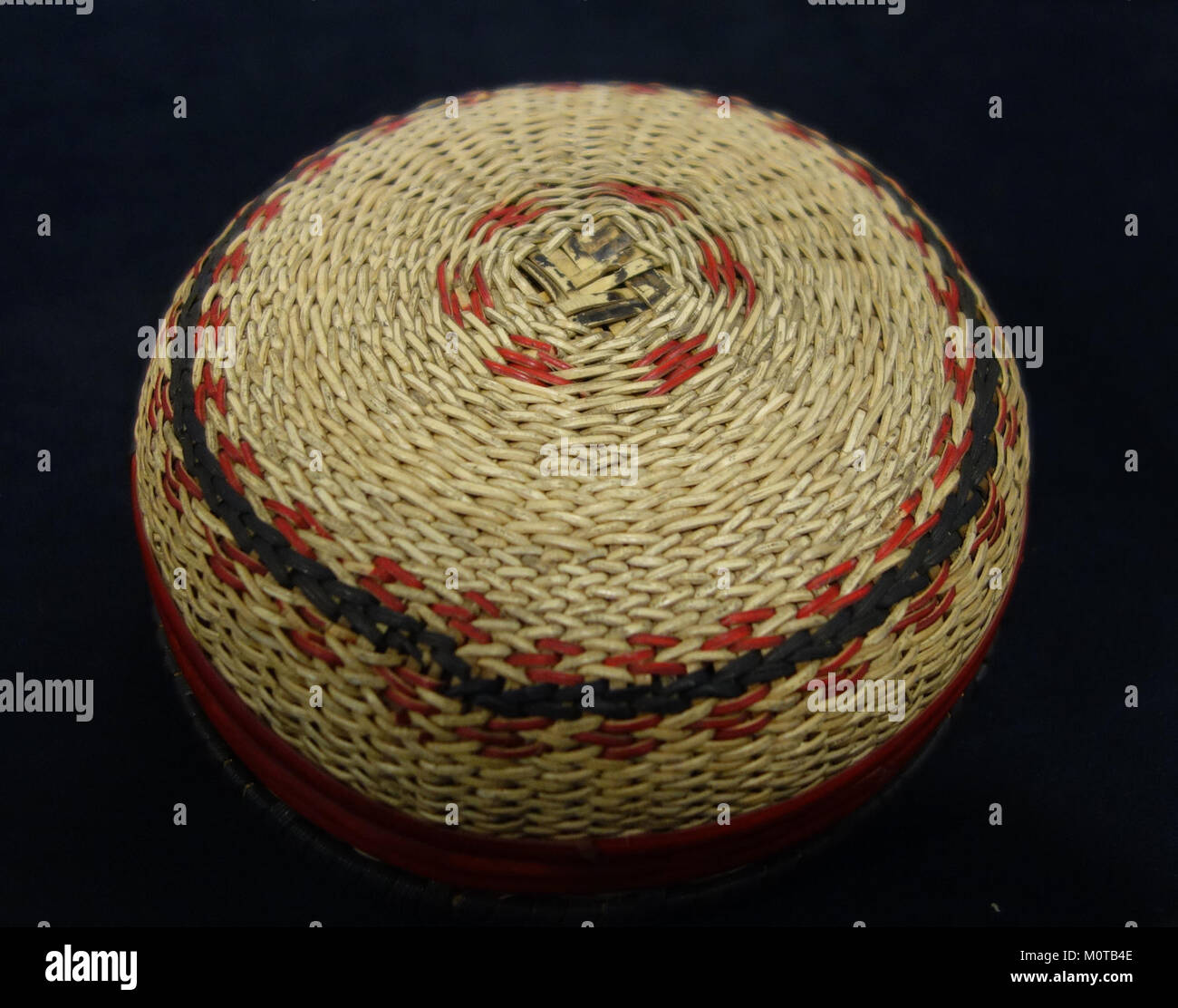 This image showcases a rattan cap from the Philippines, dating back to ...