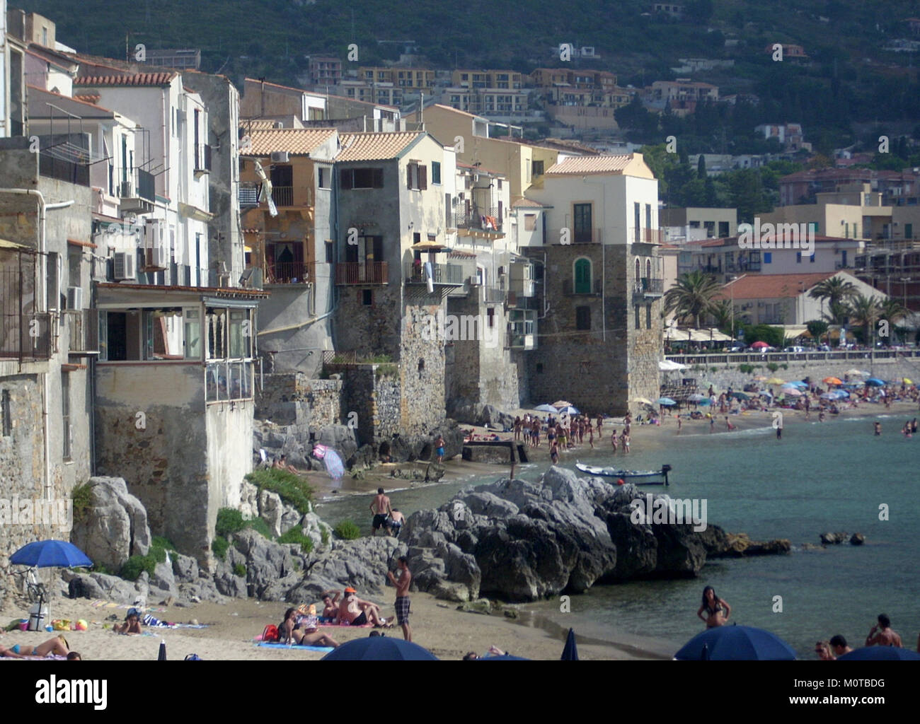 Cefalu Beach, located in Sicily, Italy, is known for its scenic beauty ...