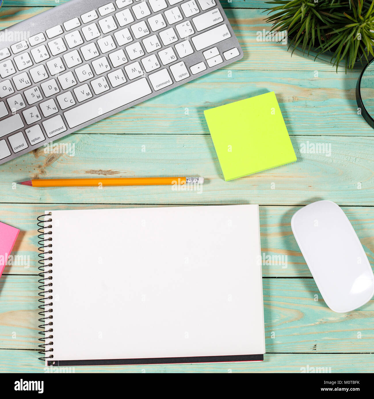 Modern green wooden office desk with laptop computer Stock Photo - Alamy