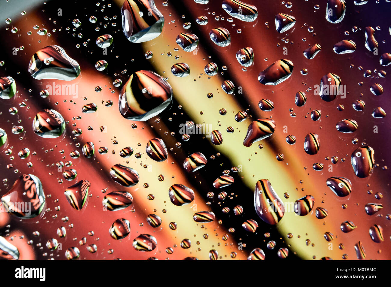 Perfect Rain Drops on Colorful Glass Stock Photo - Alamy