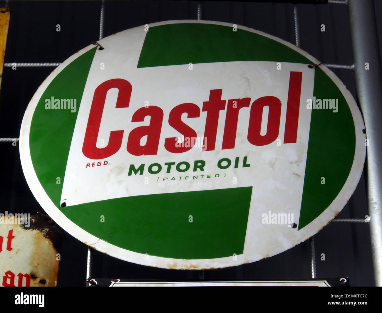 The Castrol motor oil enamel advertising sign is a vintage piece used ...