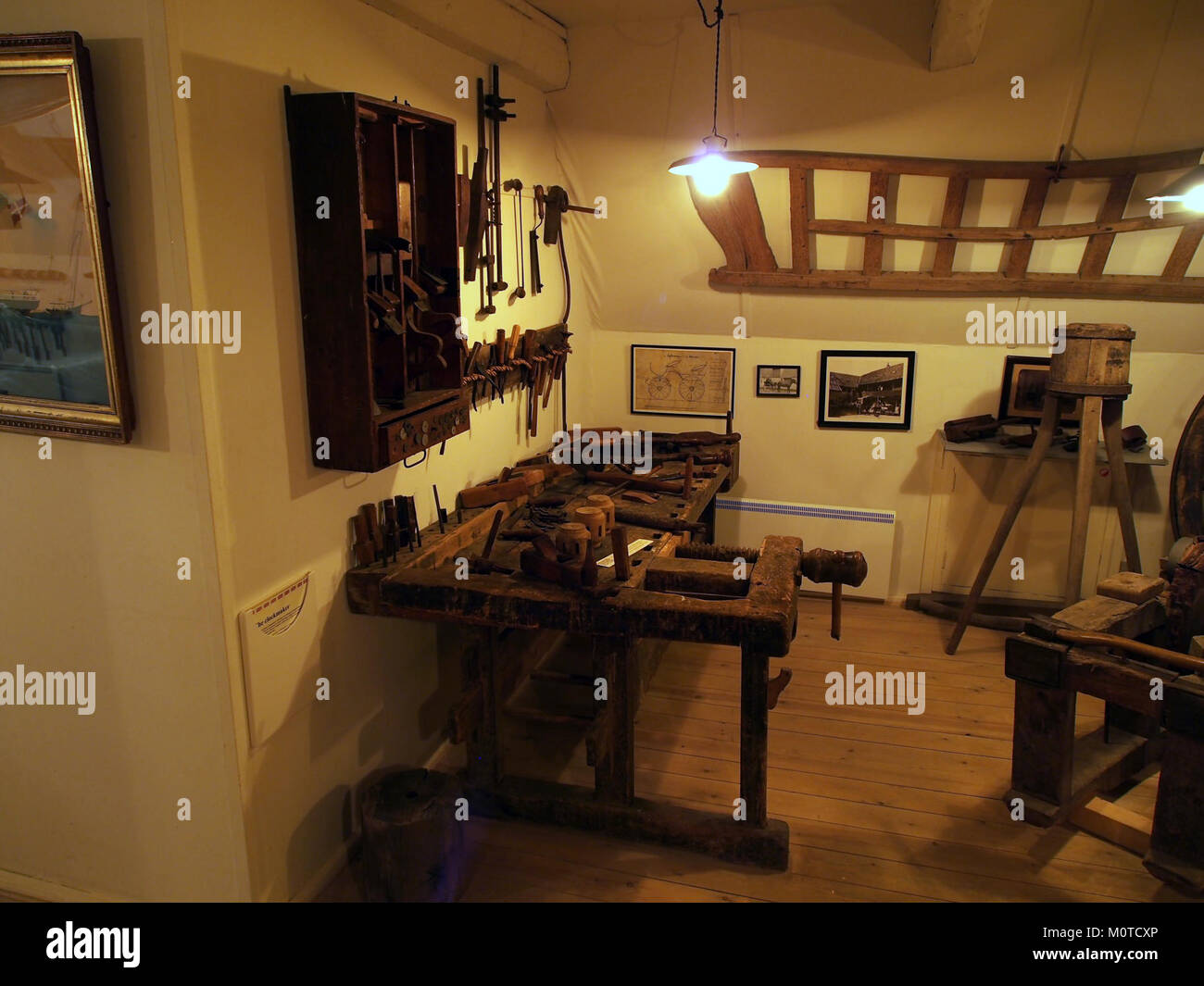 This image likely depicts a traditional carpenter workshop, showcasing ...