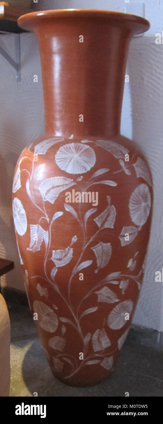 This image presents a ceramic floor vase from Maragogipe, located in ...