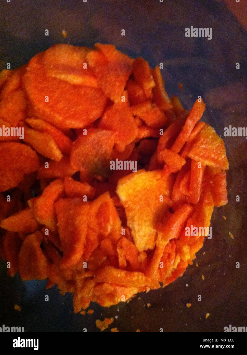 Carrot chips are a popular snack made by slicing carrots thinly and ...