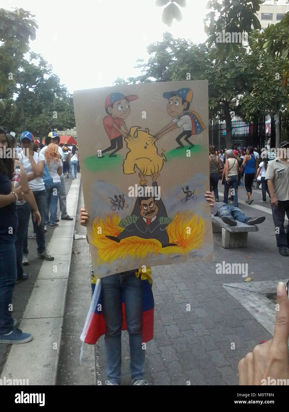 A cartoon from 2014 depicting aspects of Venezuelan culture or politics ...