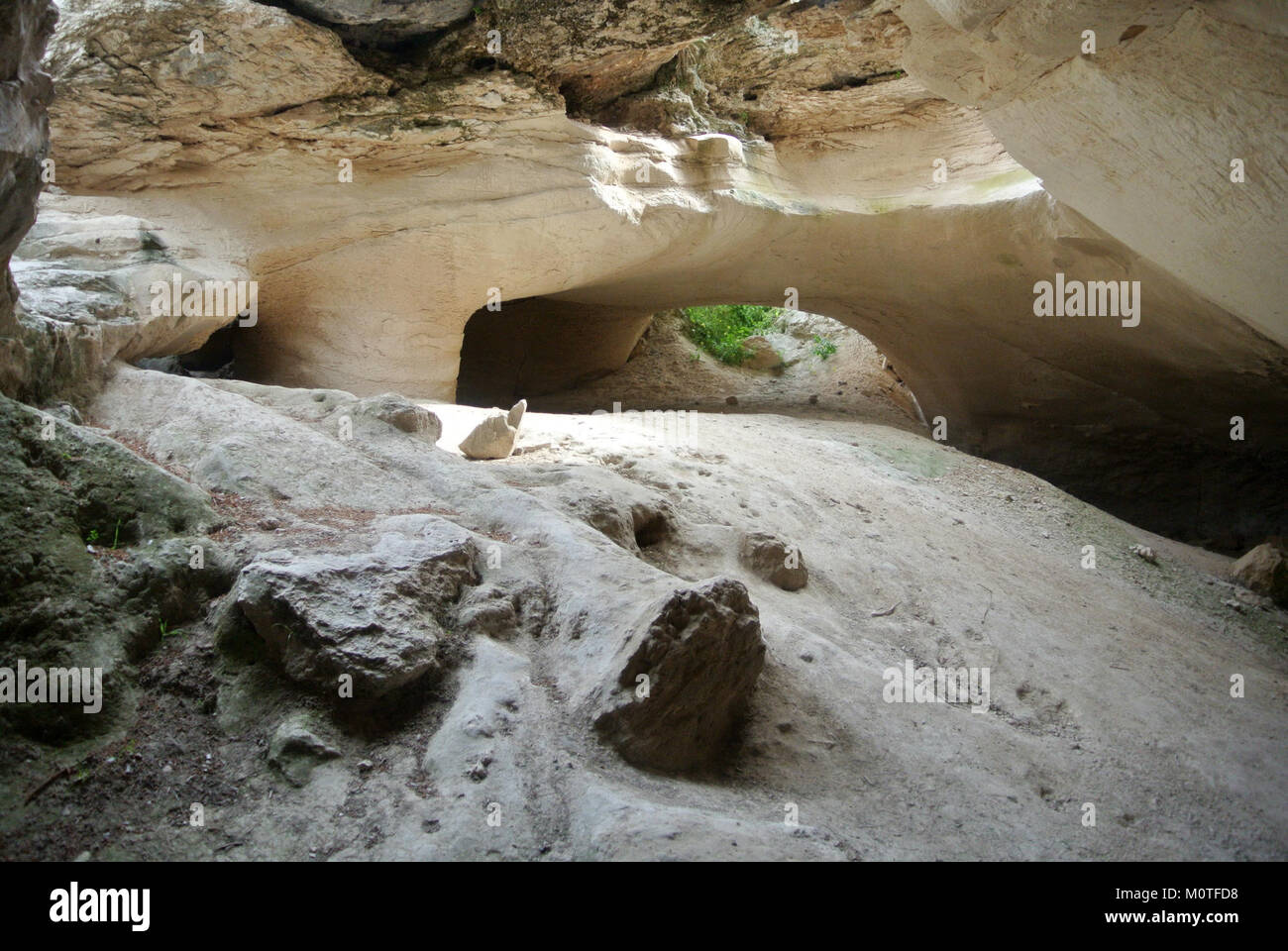 A photograph of a cave under Tel Azeka, an archaeological site in ...