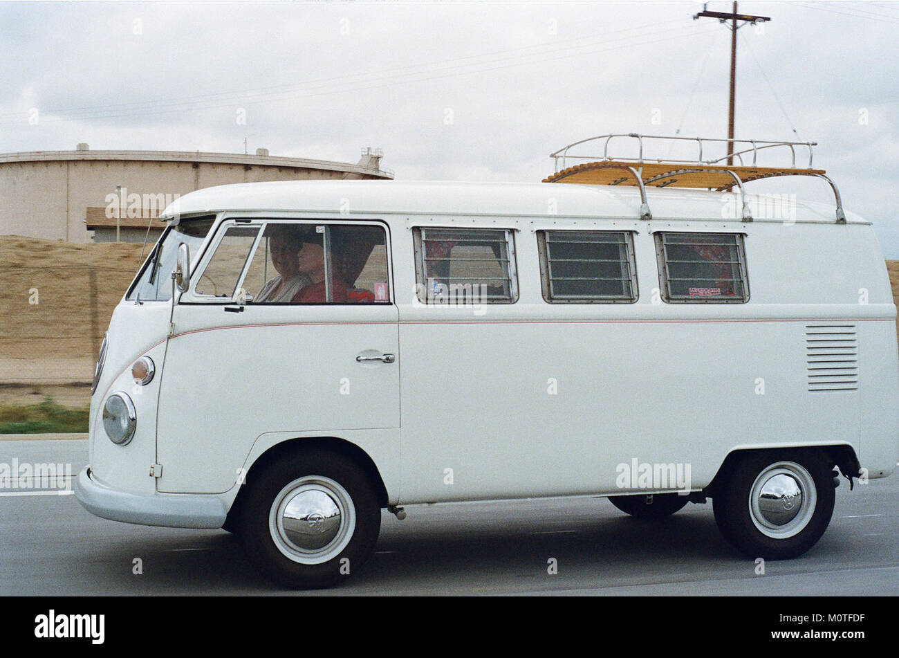 This image showcases a vintage car in motion, highlighting the classic ...