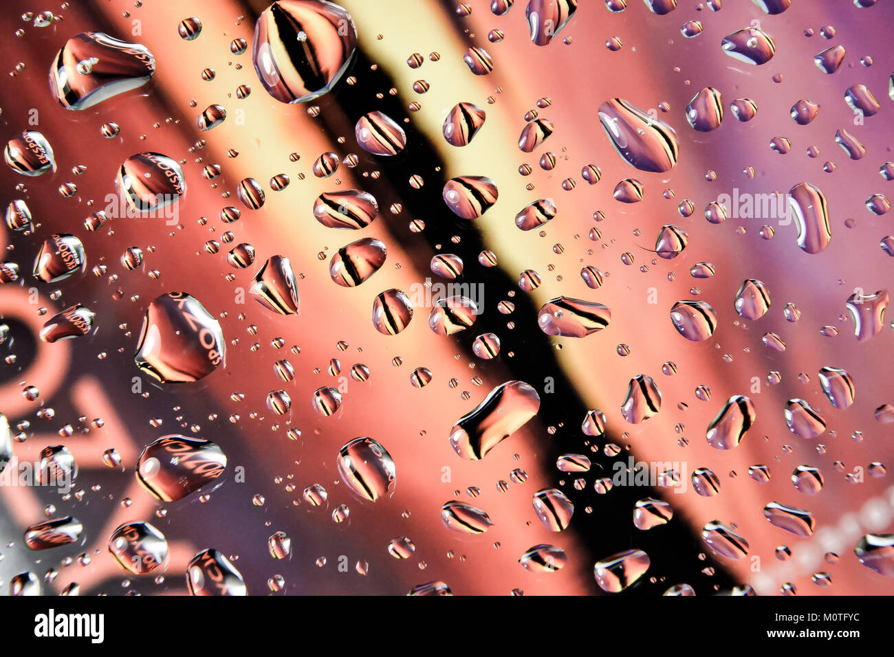 Perfect Rain Drops on Colorful Glass Stock Photo - Alamy