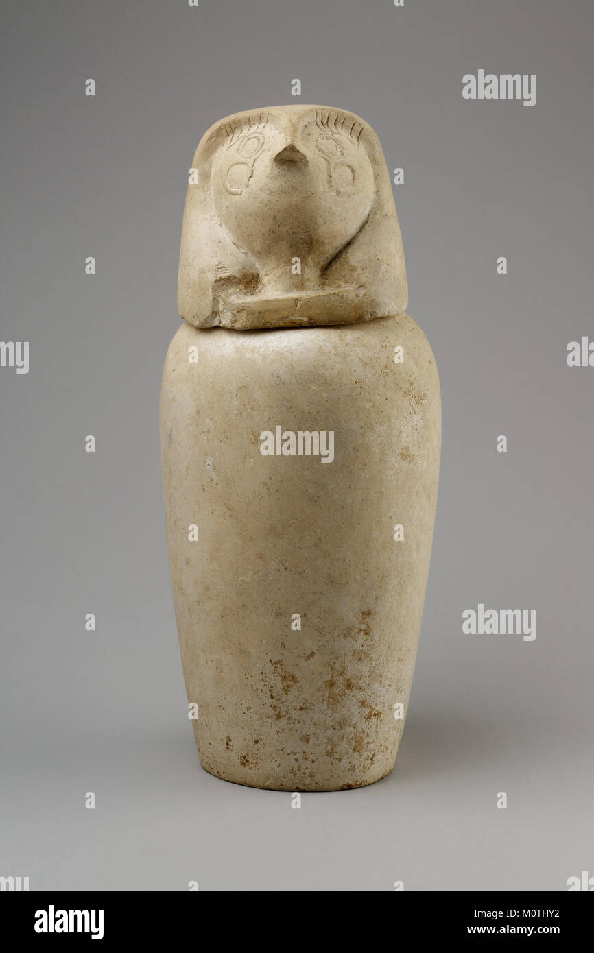 A canopic jar with a falcon head representing the ancient Egyptian god ...