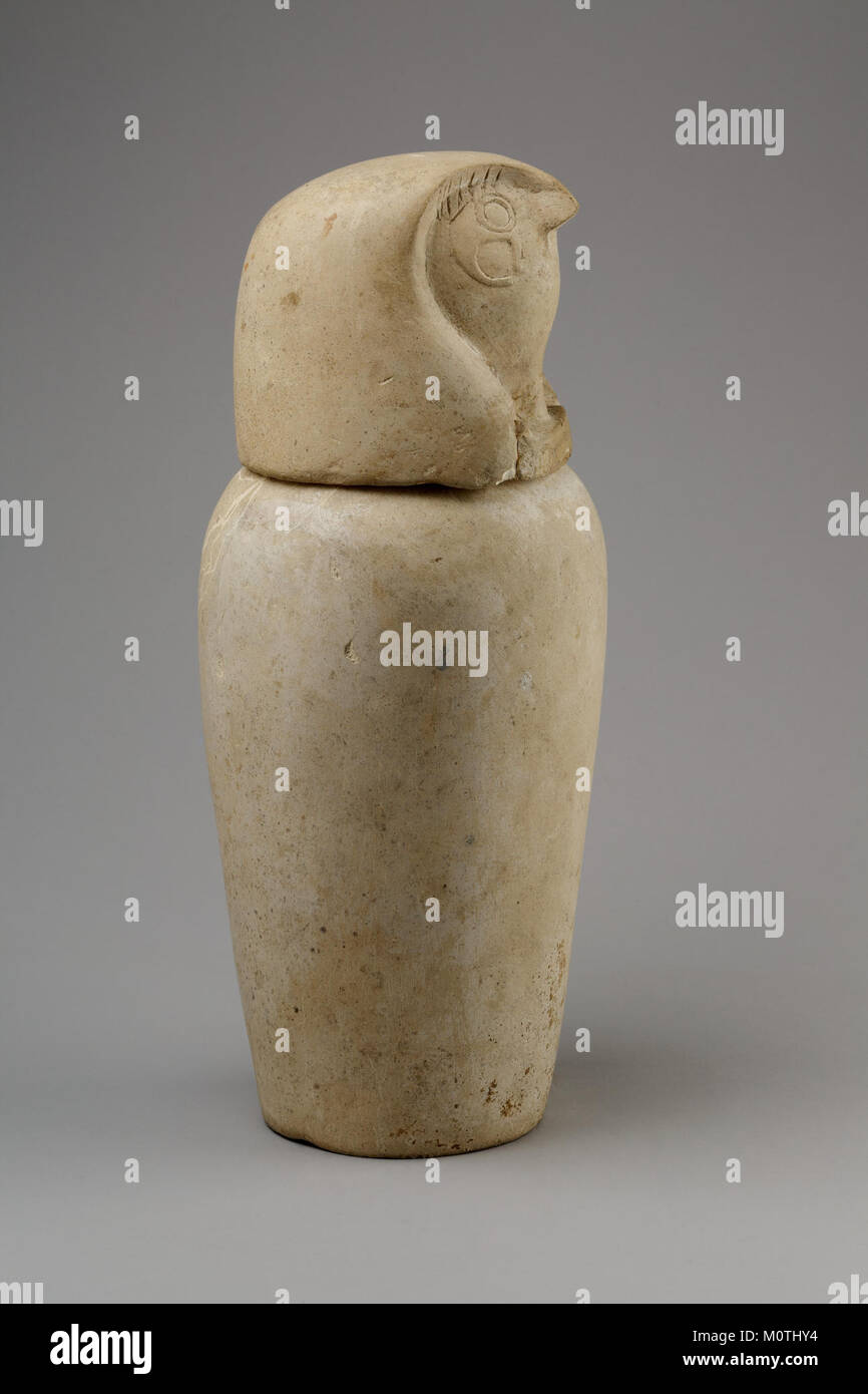 This ancient Egyptian canopic jar, featuring a falcon head, is ...