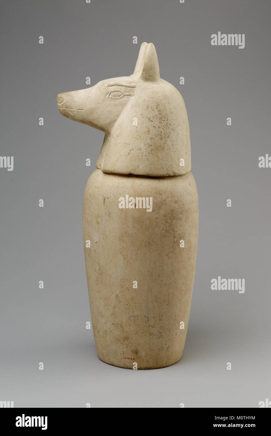 This canopic jar, used in ancient Egyptian burial practices, features a ...