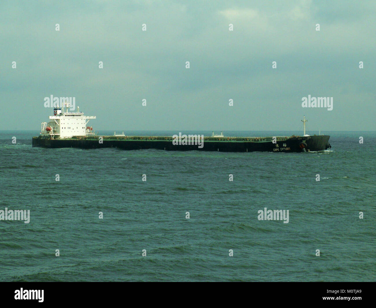 The image captures the Cape Saturn, a cargo ship, approaching the Port ...