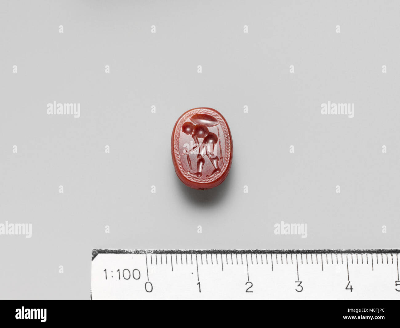 A carnelian scarab, an ancient Egyptian artifact, is displayed at the ...