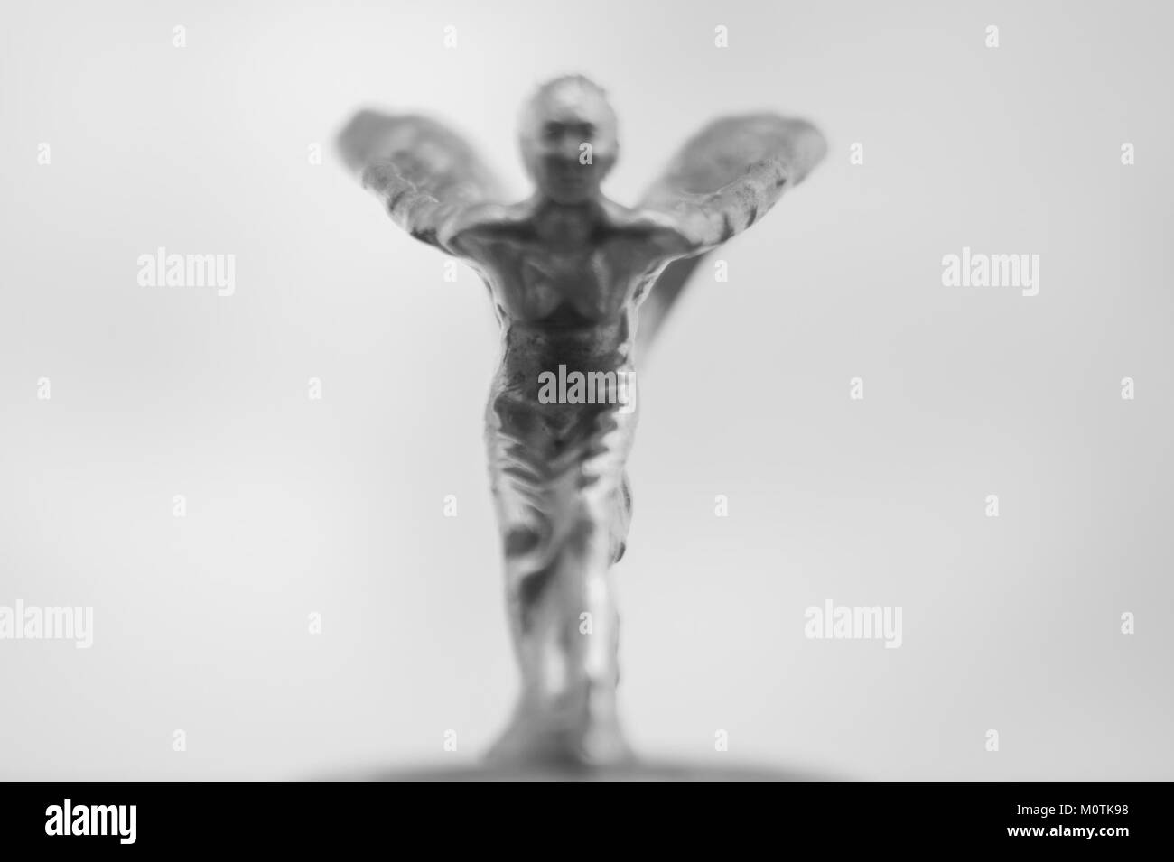 This image features a creative artwork depicting a car, a statue, and a ...