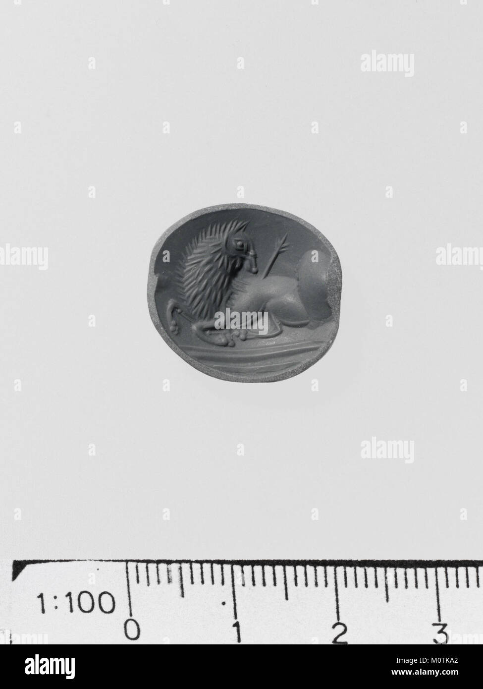 This image features a carnelian lentoid seal, an ancient artifact ...