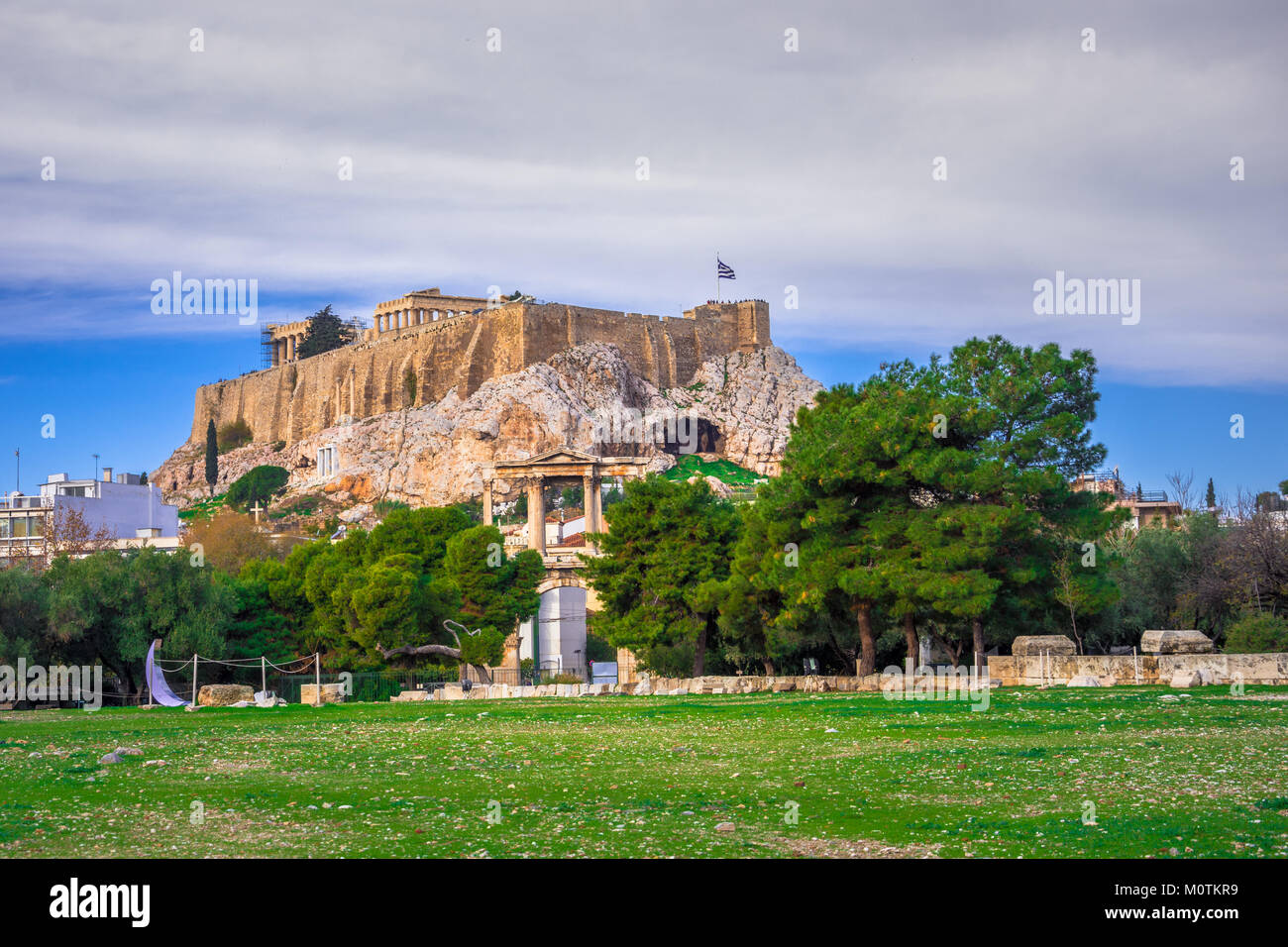 Acropolis with Parthenon. View through a frame of green plants, trees ...