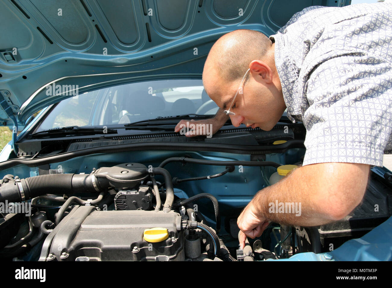 Businessman opening the trunk and checking the engine of a car Stock ...