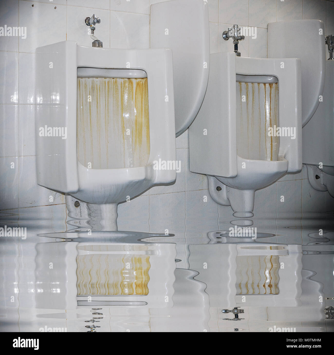 Close up dirty Urinal in public toilet with reflection Stock Photo - Alamy