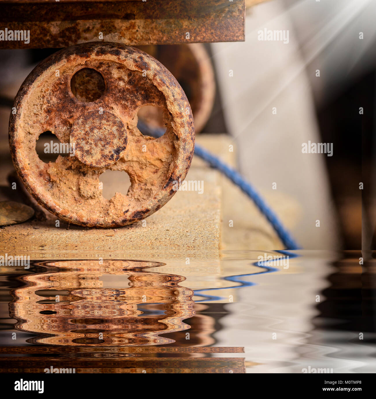 Old rusty Slide door with wheel and reflection Stock Photo - Alamy