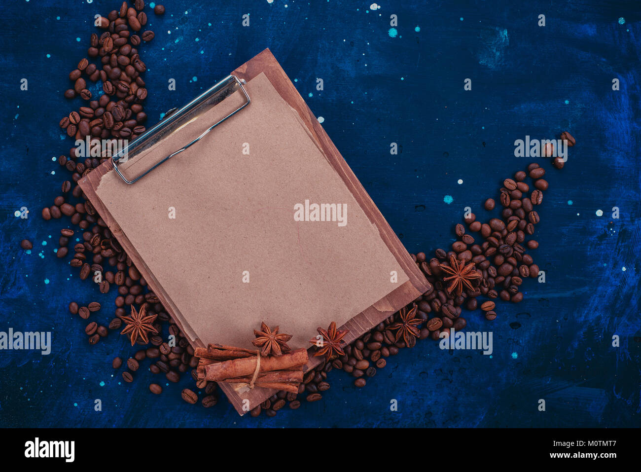 Blank wooden clipboard with craft paper in a header with coffee beans ...