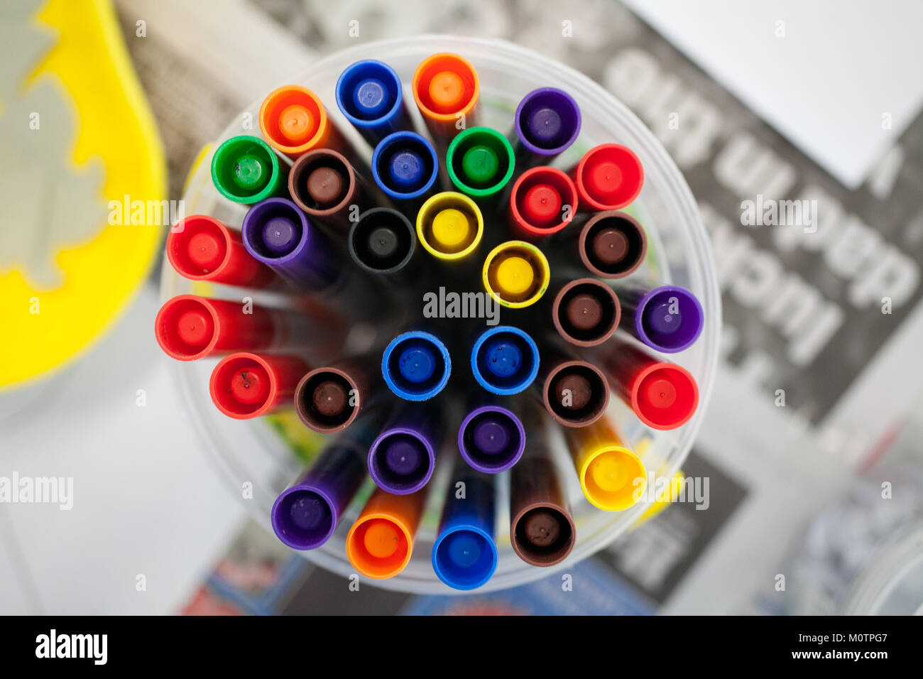Tub of coloured pens at a kindergarten Stock Photo - Alamy