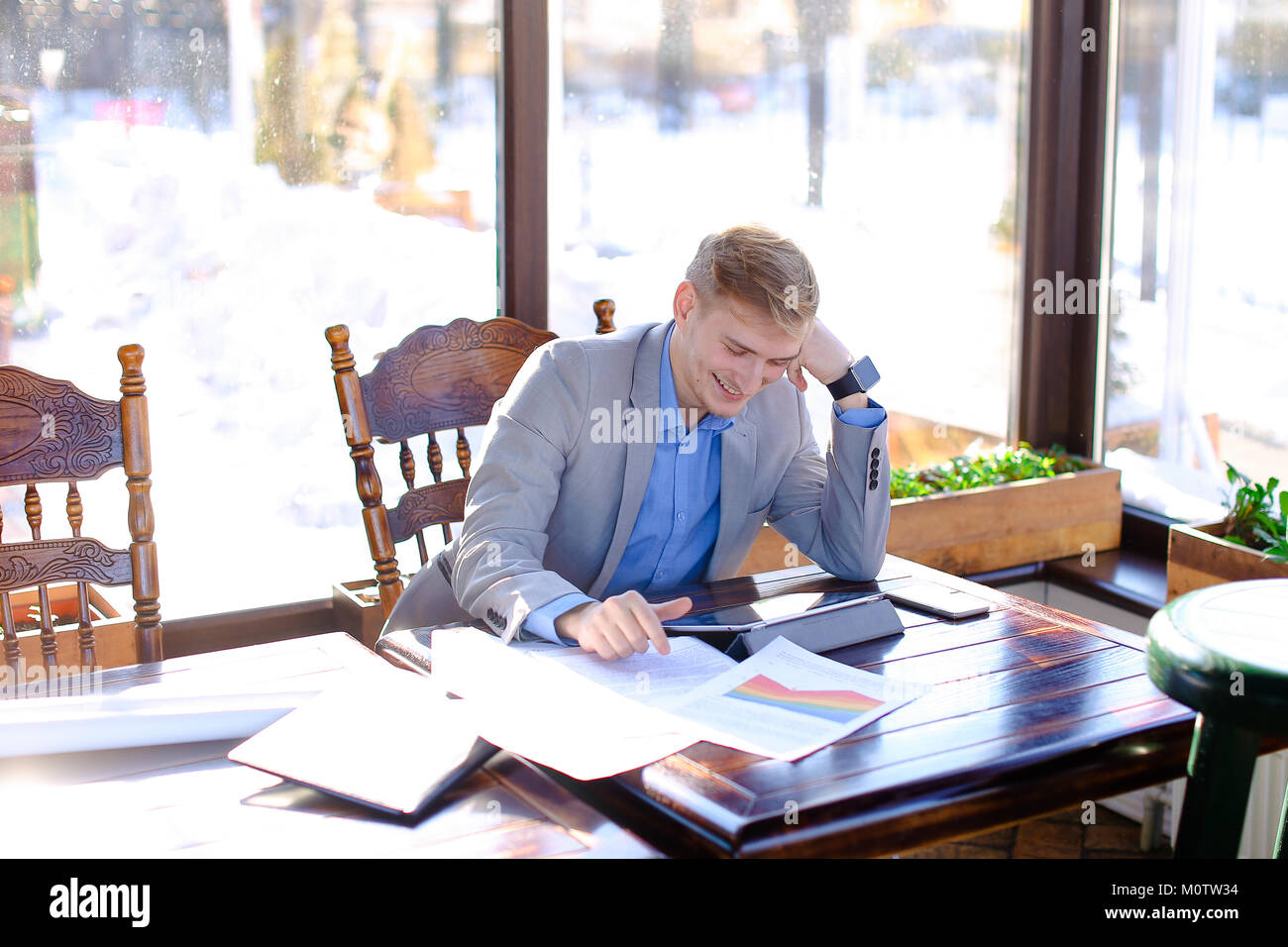 Young student preparing before exam in fast motion at cafe with Stock ...