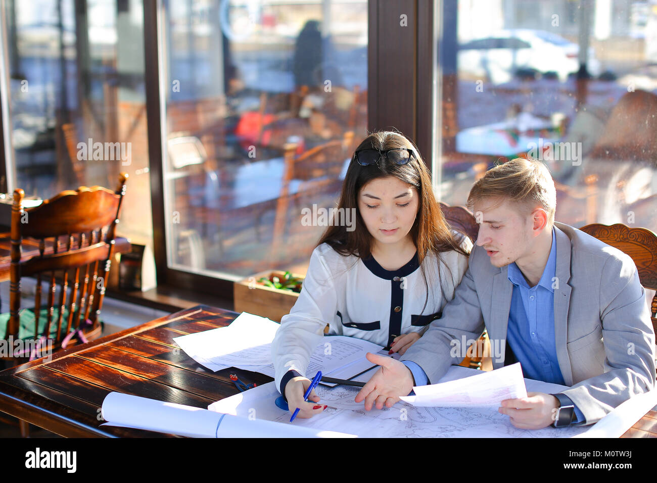 Architectural students calling by smartphone to teacher to ask a Stock ...