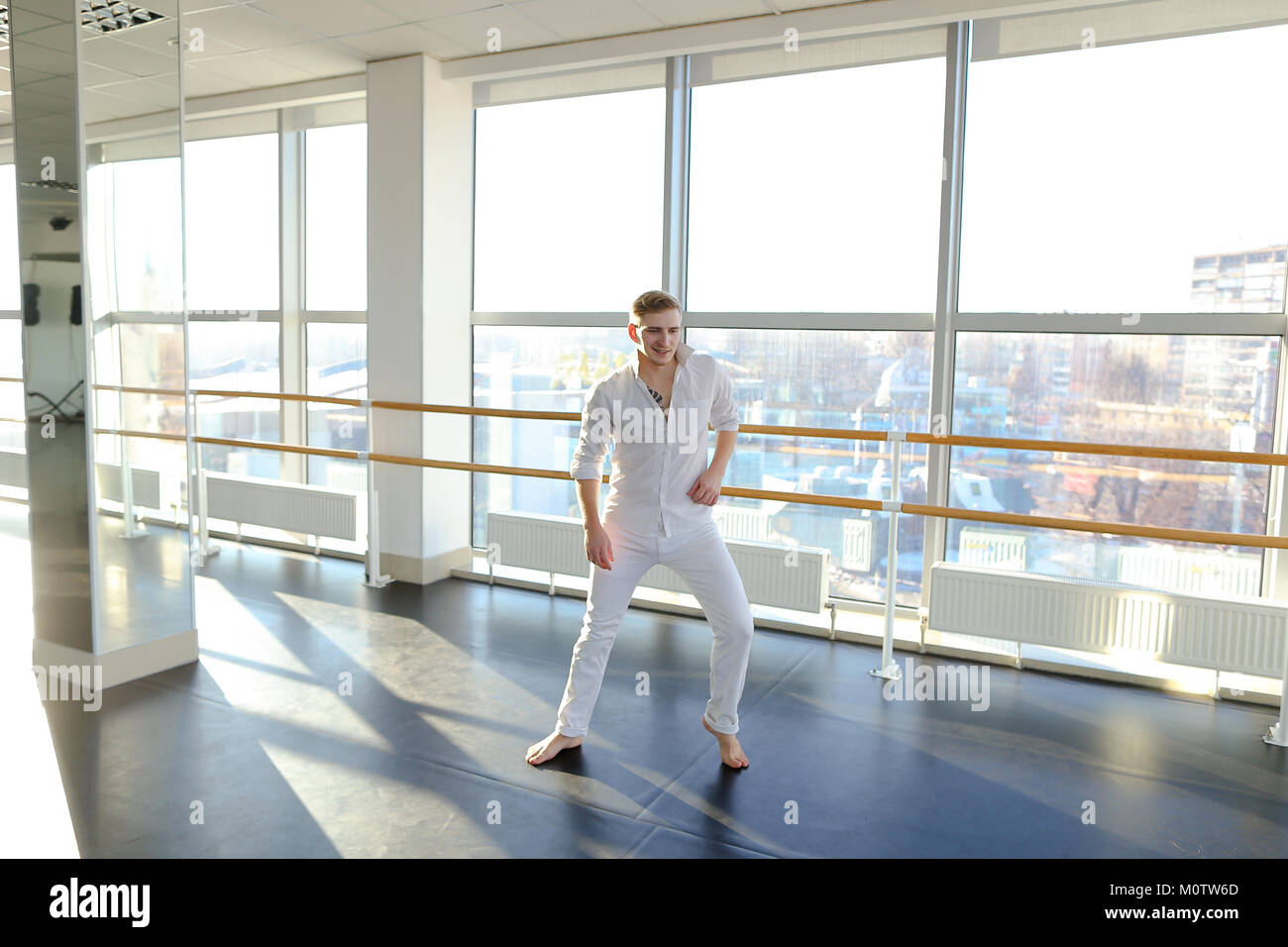 Male person dancing in street style way and jumping Stock Photo - Alamy