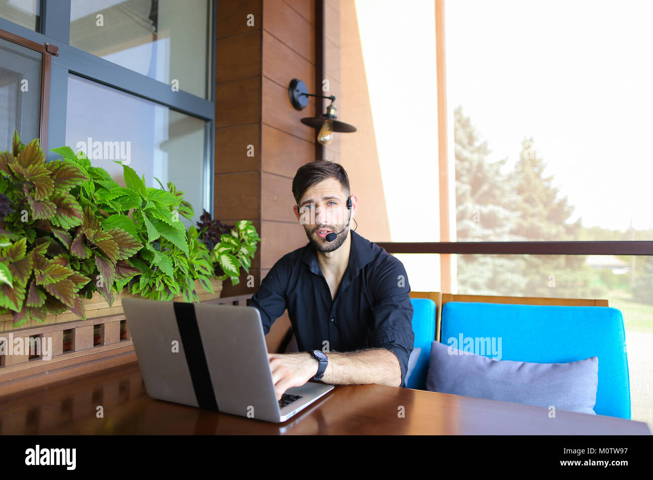 Educational consultant speaking with clients with laptop video c Stock ...
