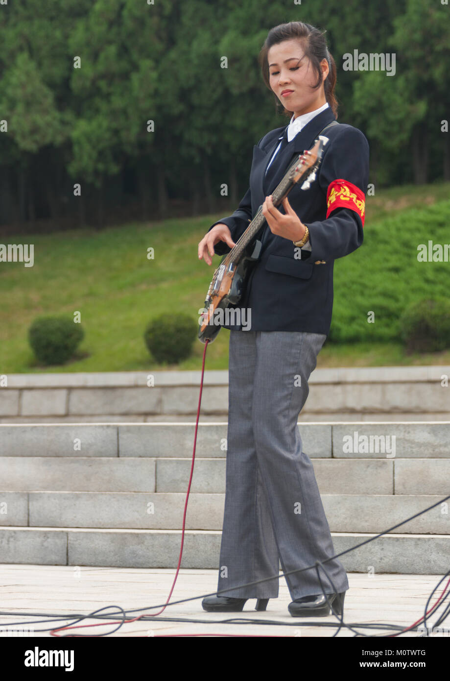 North Korean state artist playing bass on national day, Pyongan ...