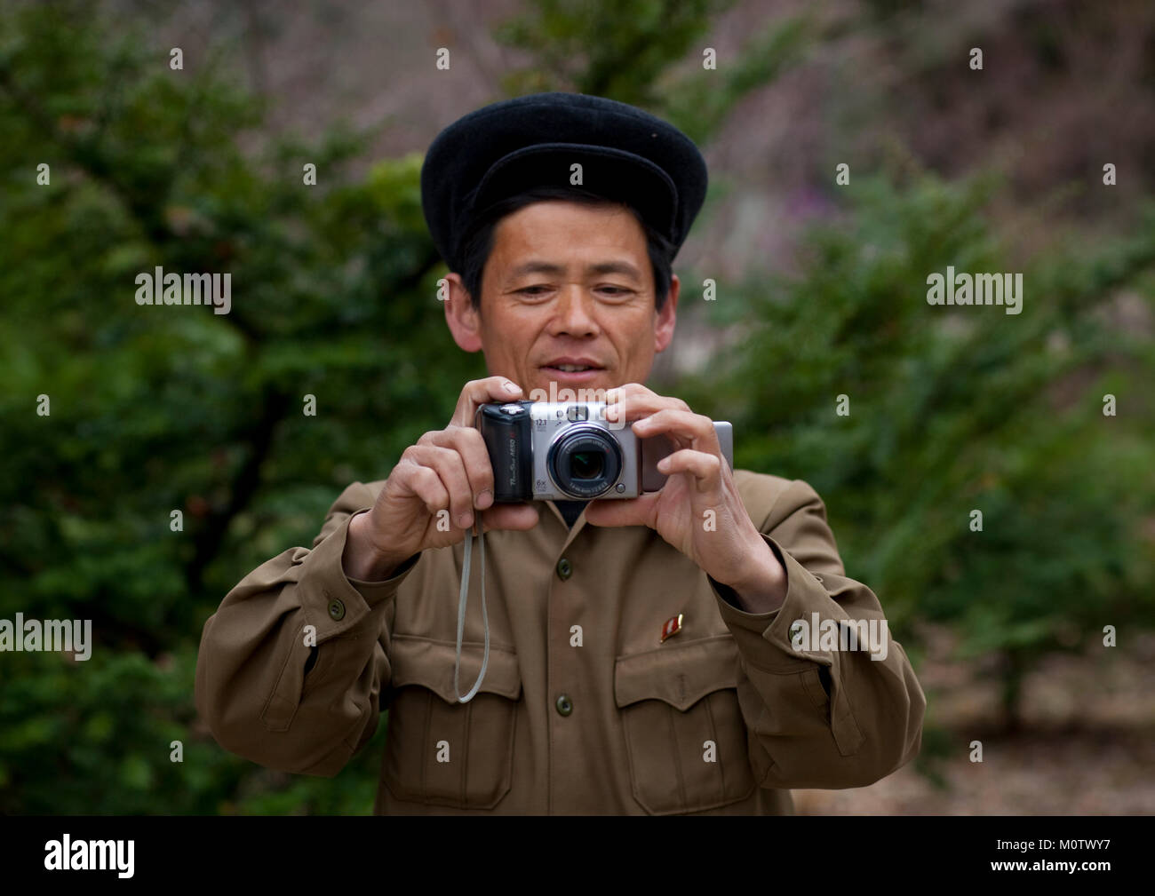 Man photographing with a canon camera hi-res stock photography and ...