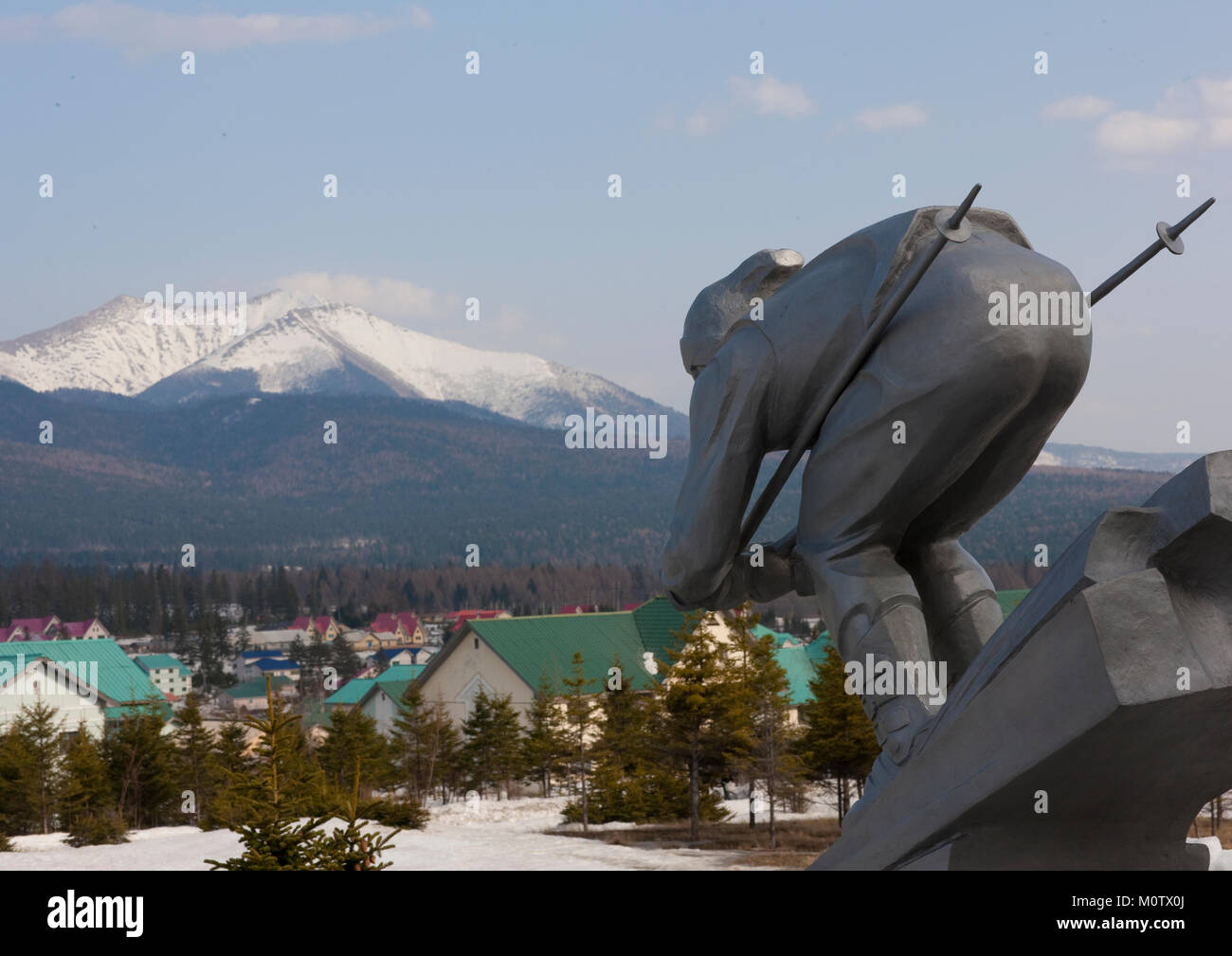 Statue of a skier in front of mount Paektu, Ryanggang Province ...