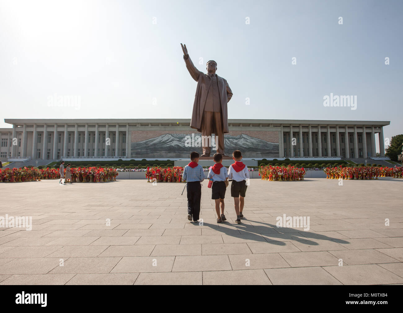 North Korean pioneers in front of the Kim il Sung statue in Mansudae ...