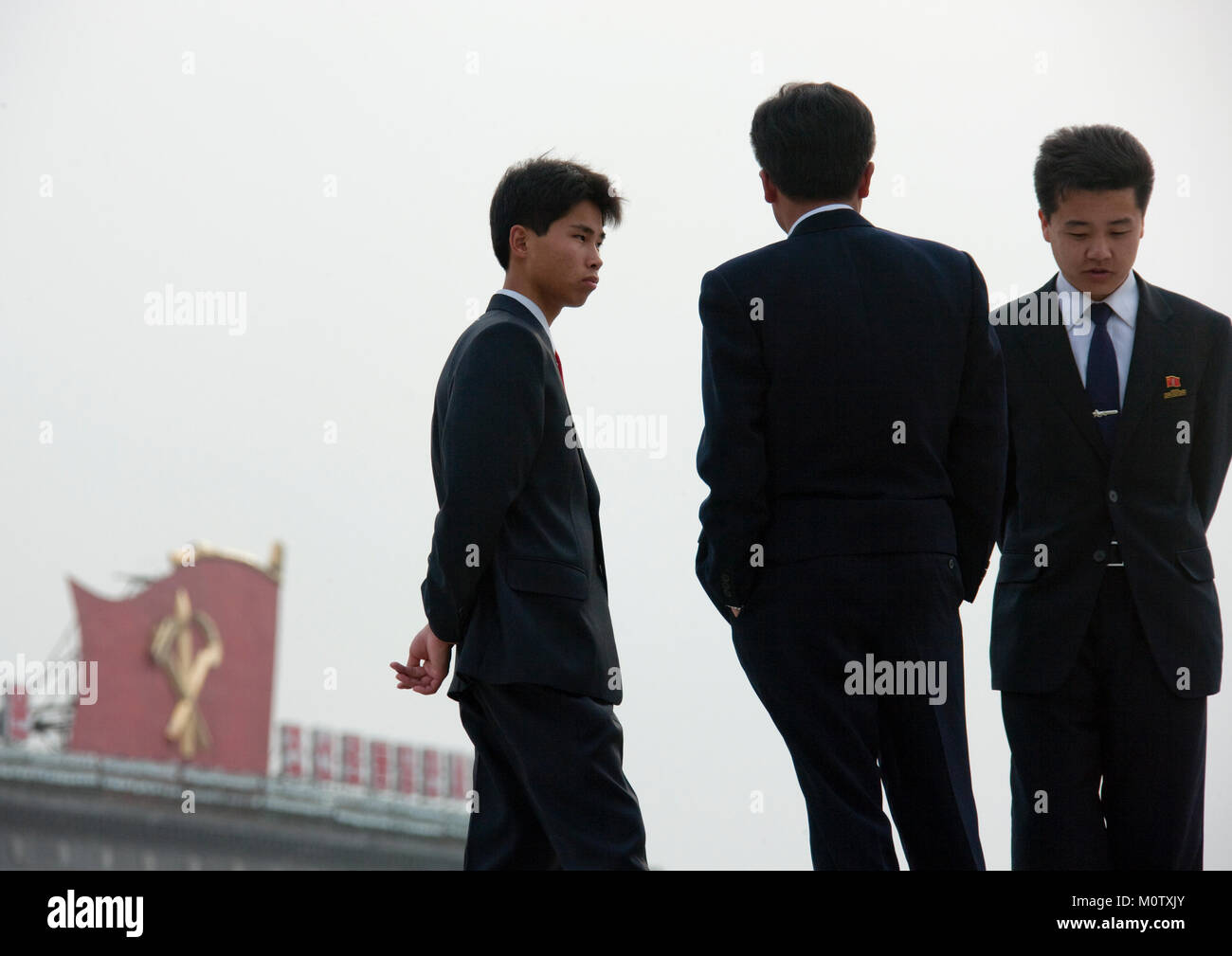 North Korean young men in black suits in Kim il Sung square, Pyongan ...