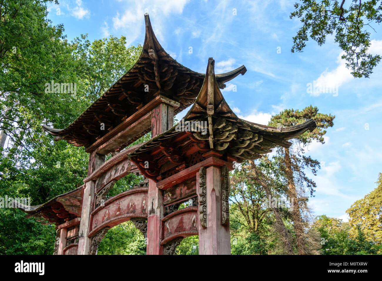 View from below of the old wooden chinese gate in the garden of ...