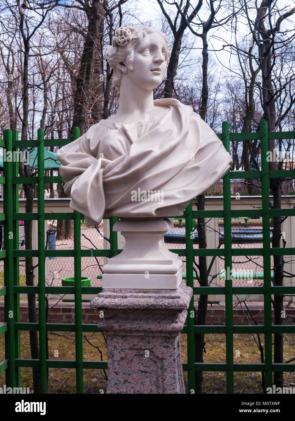Bust sculpture allegory of spring in the park Summer garden near the ...