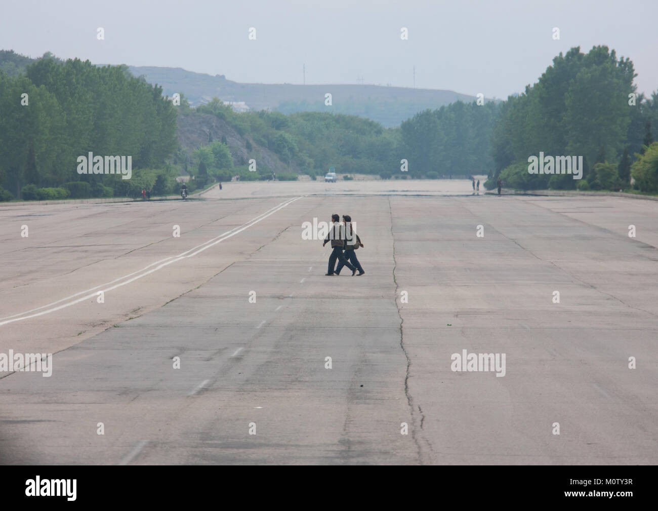 North Korean women crossing an empty highway, Pyongan Province ...