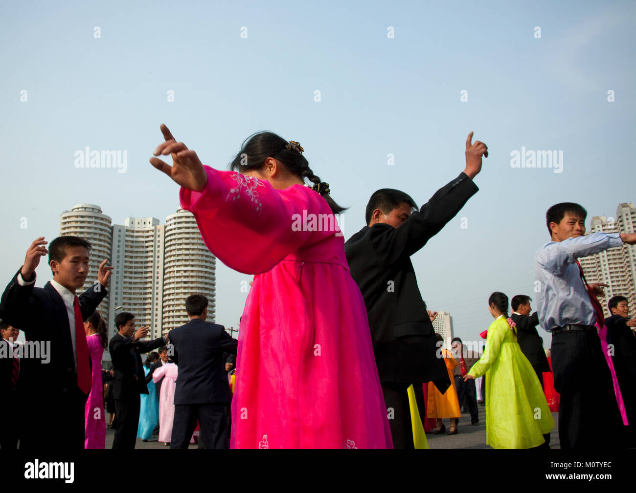 North Korean young adults during a mass dance performance in front of ...