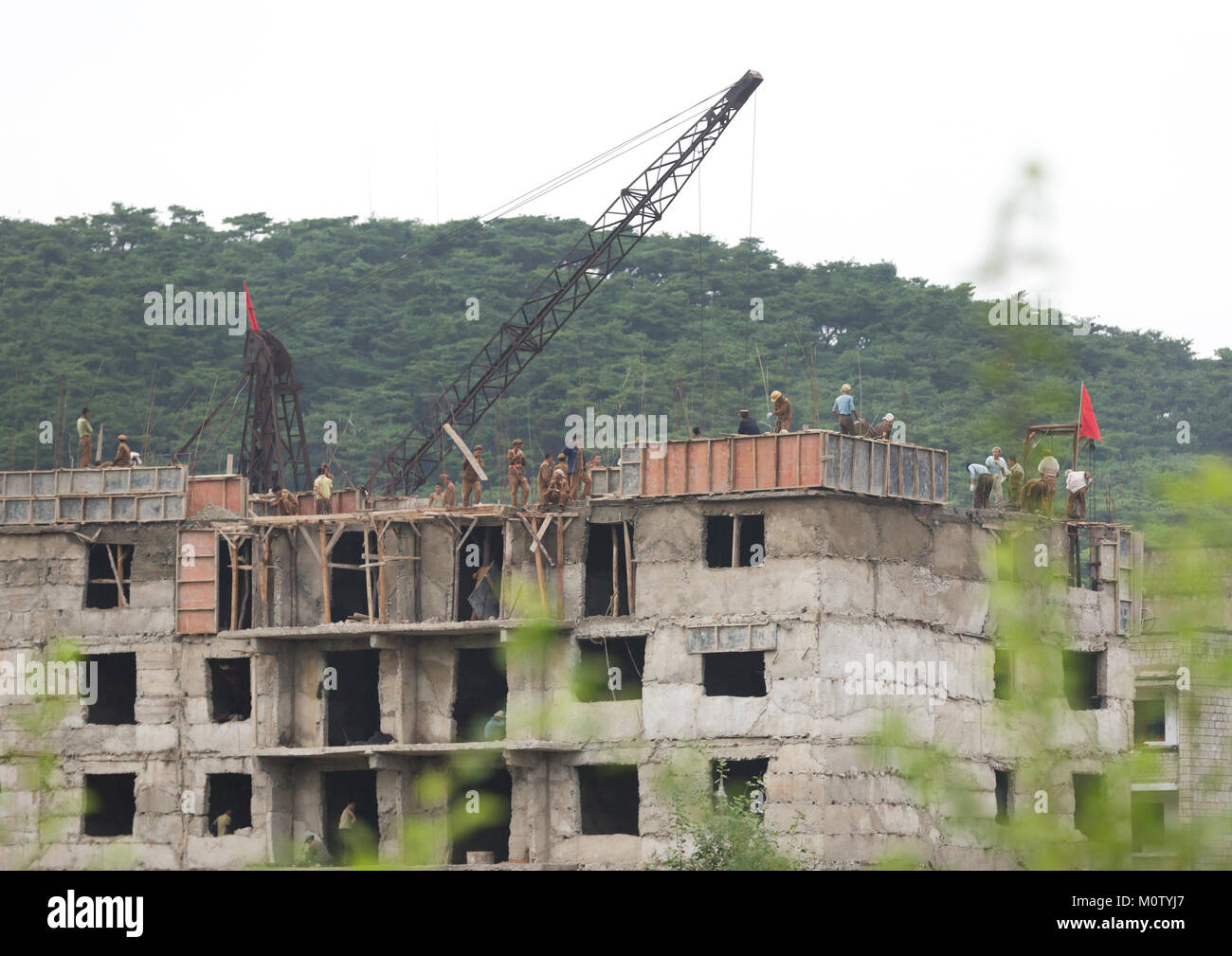 North Korean men working on a construction site, Pyongan Province ...