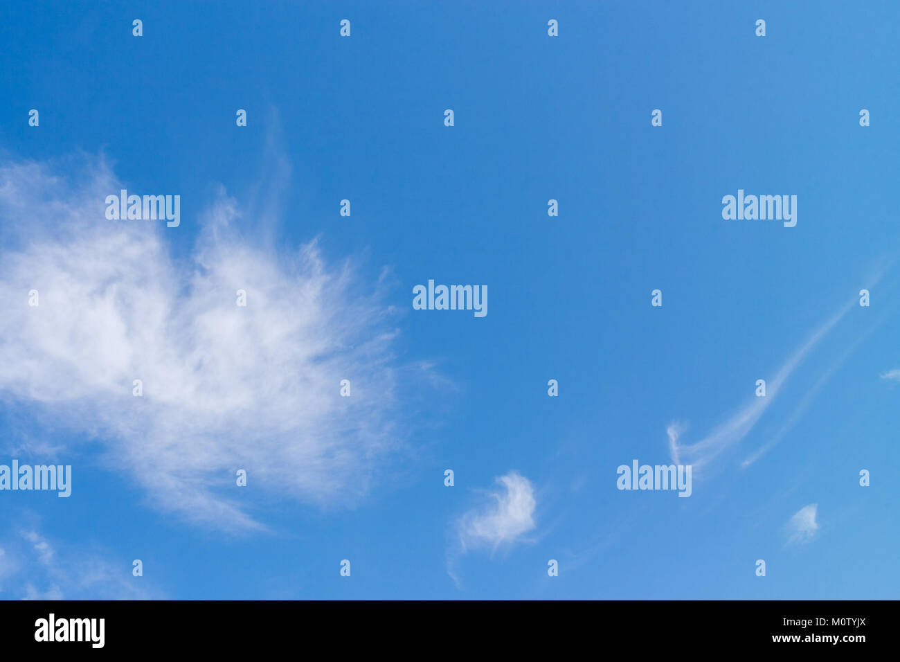White large fluffy rounded cloud on bright blue sky Stock Photo - Alamy
