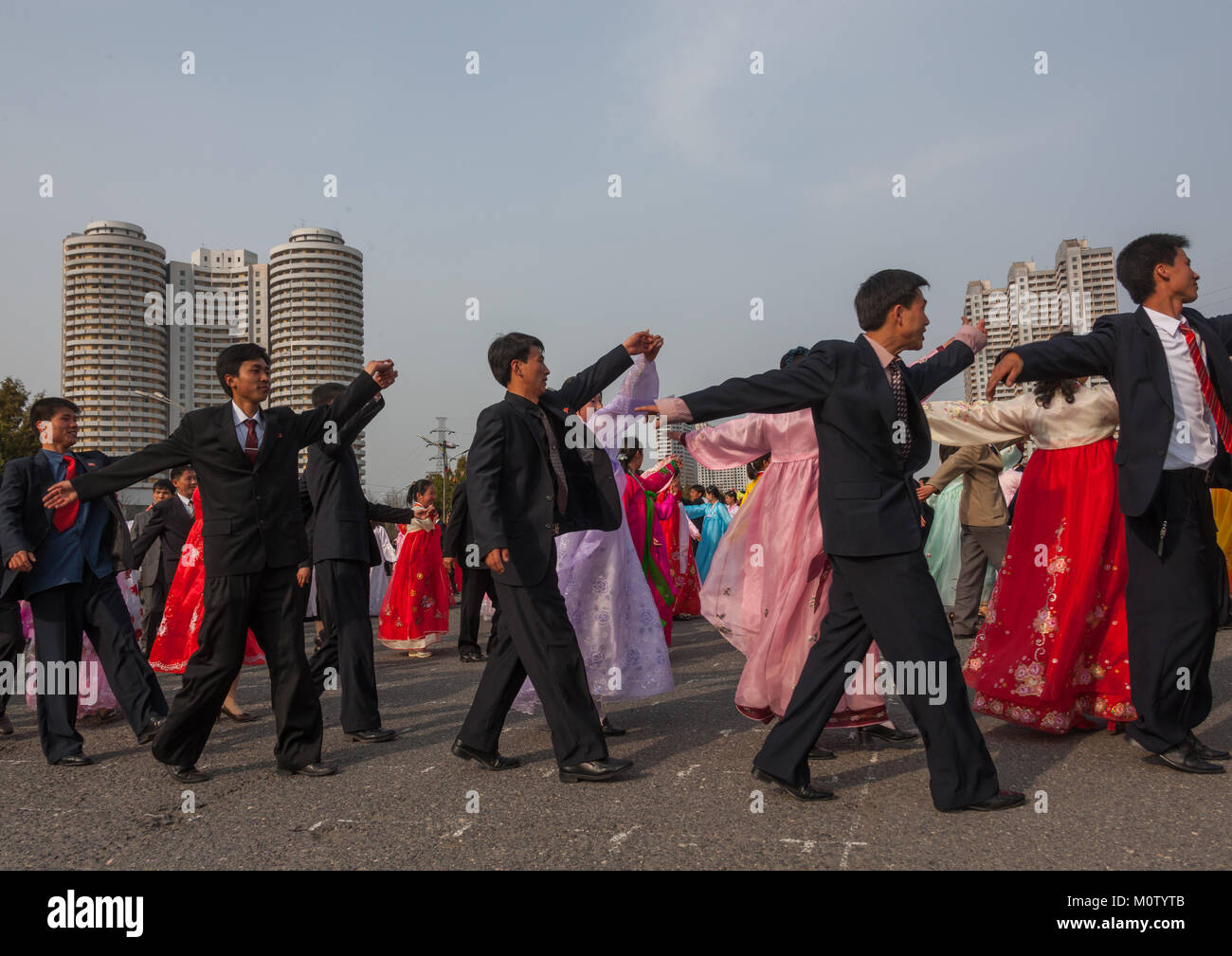 North Korean young adults during a mass dance performance in front of ...