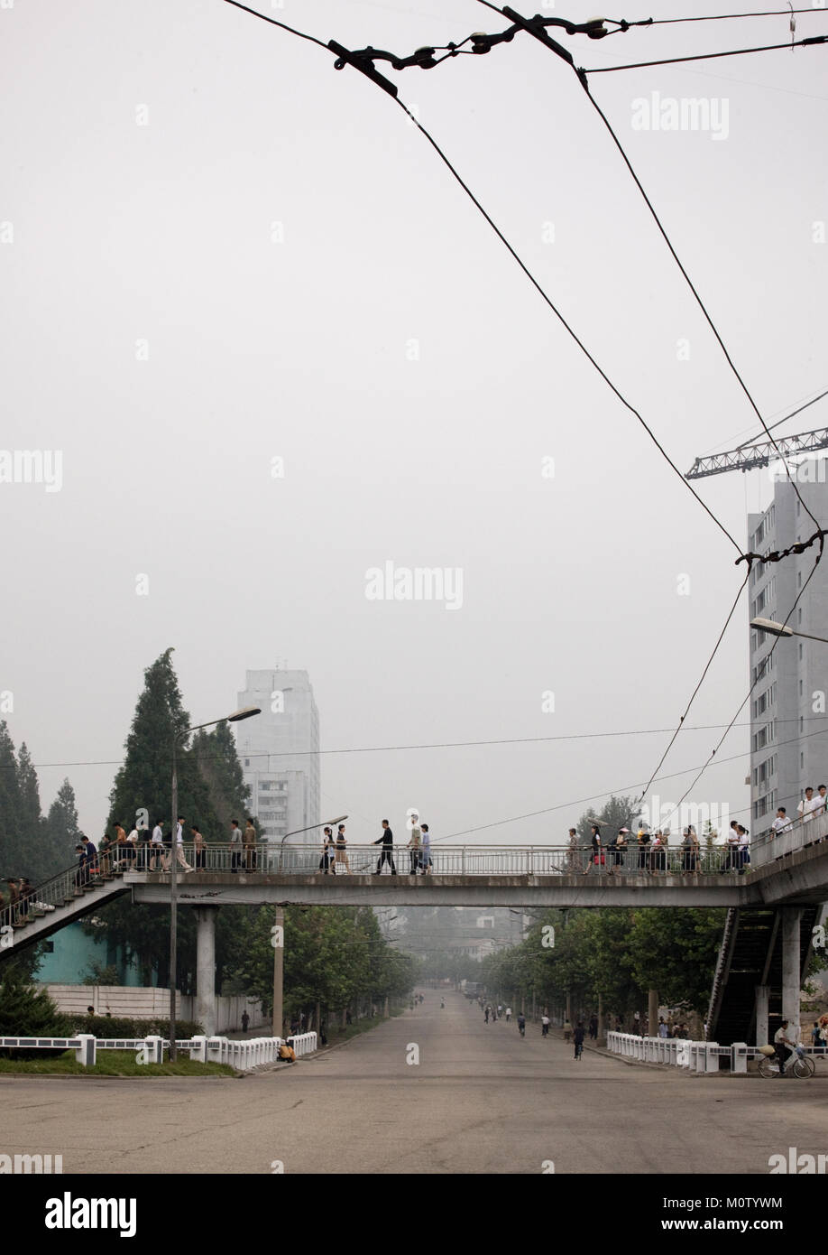 North Korean people crossing a bridge in town, Pyongan Province ...