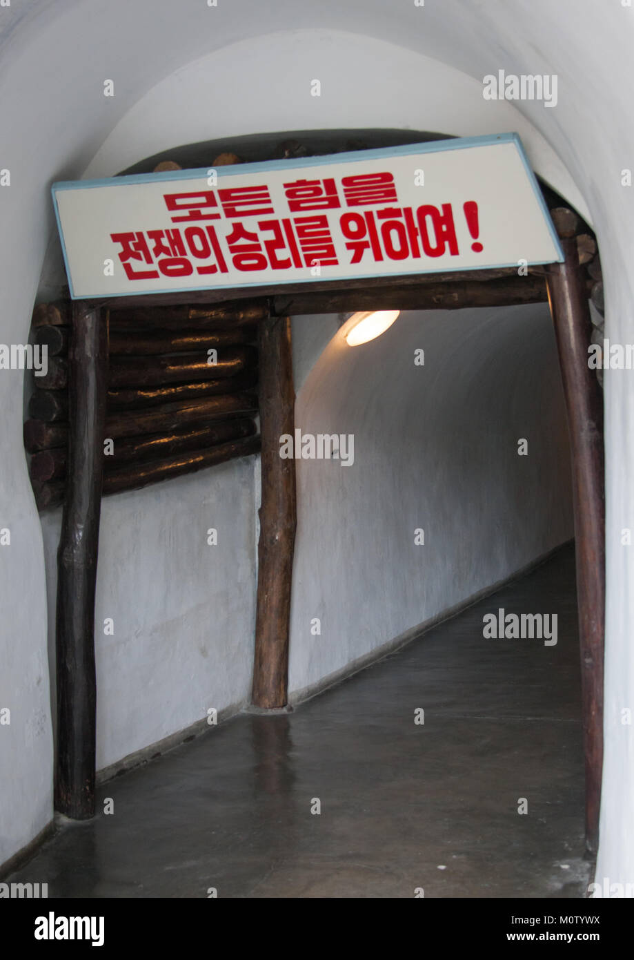 Tunnel in Jonsung revolutionary museum with the slogan all the powers ...