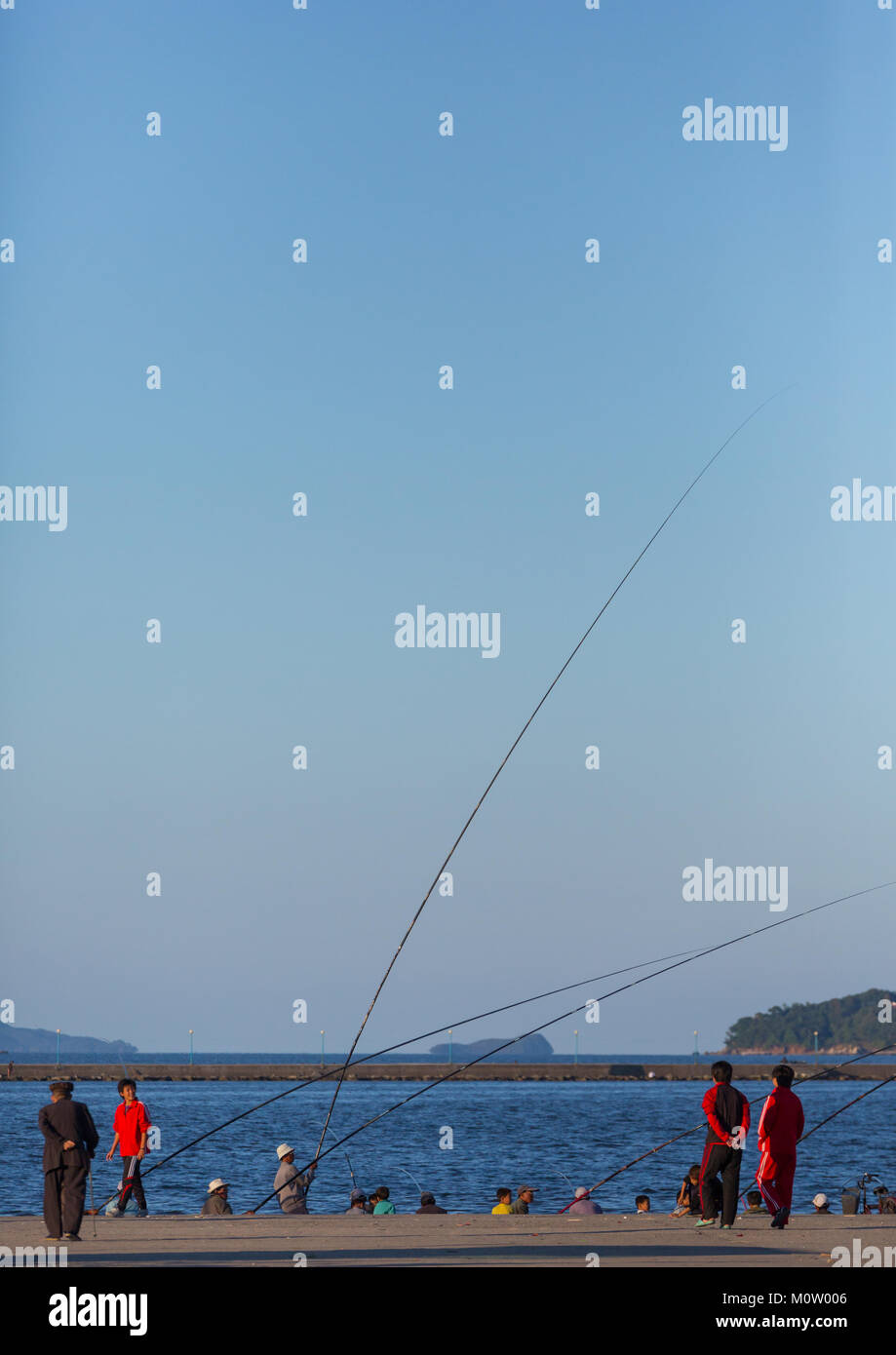 North Korean men fishing in the port, Kangwon Province, Wonsan, North ...