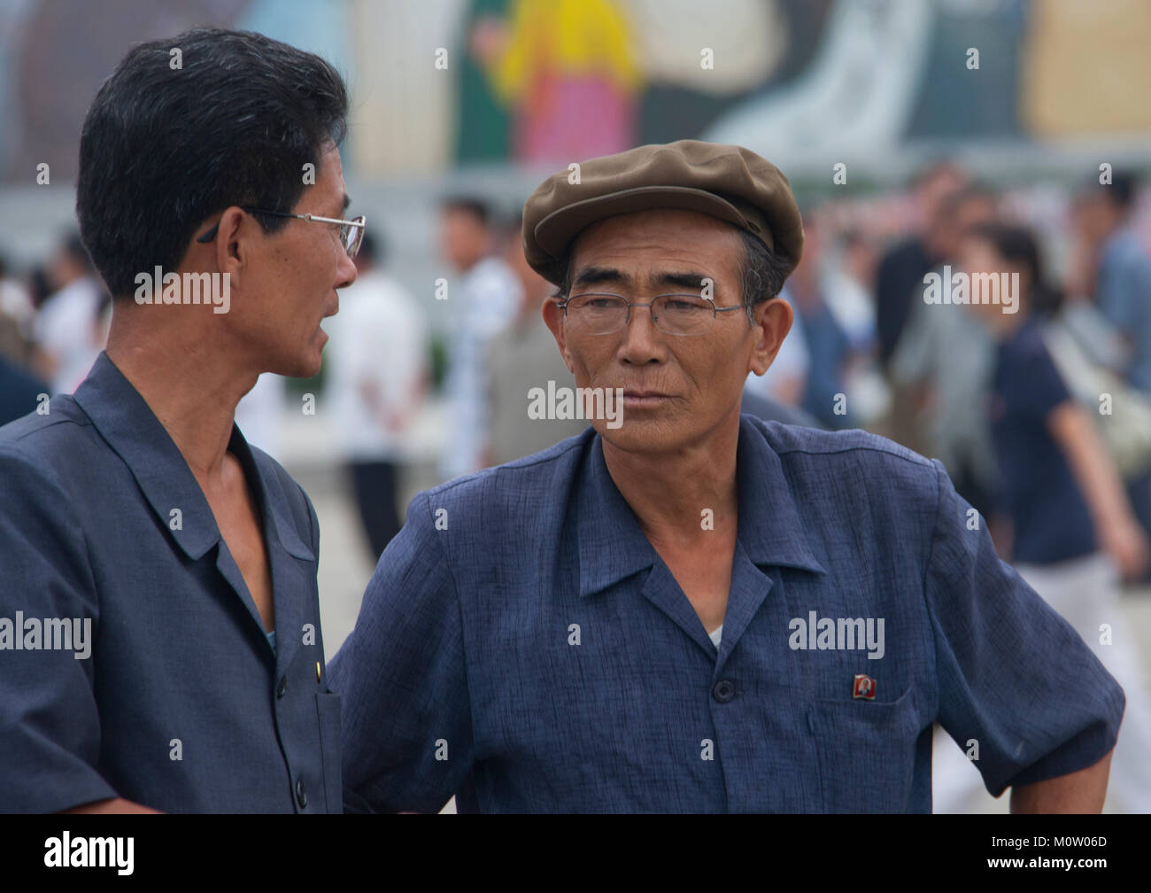 Two North Korean men chatting in the street, Pyongan Province ...