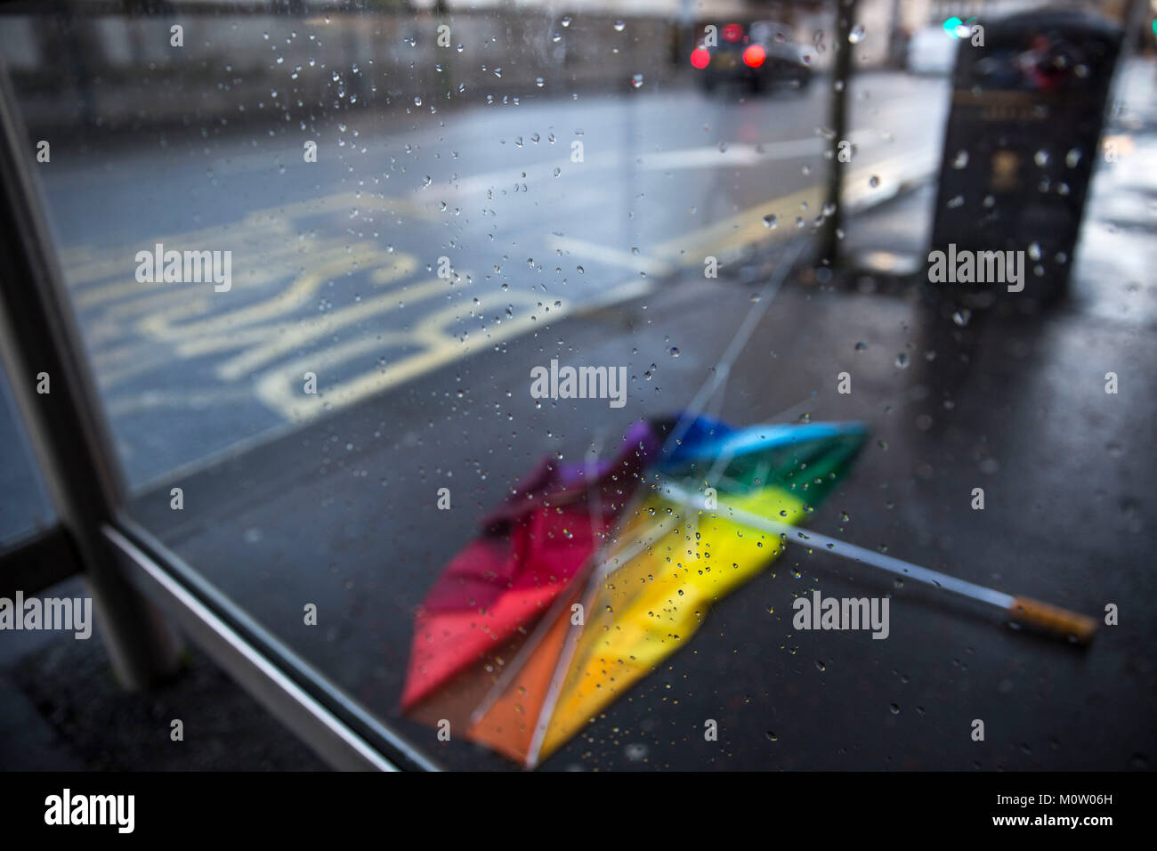 Waiting for bus in the rain hi-res stock photography and images - Alamy