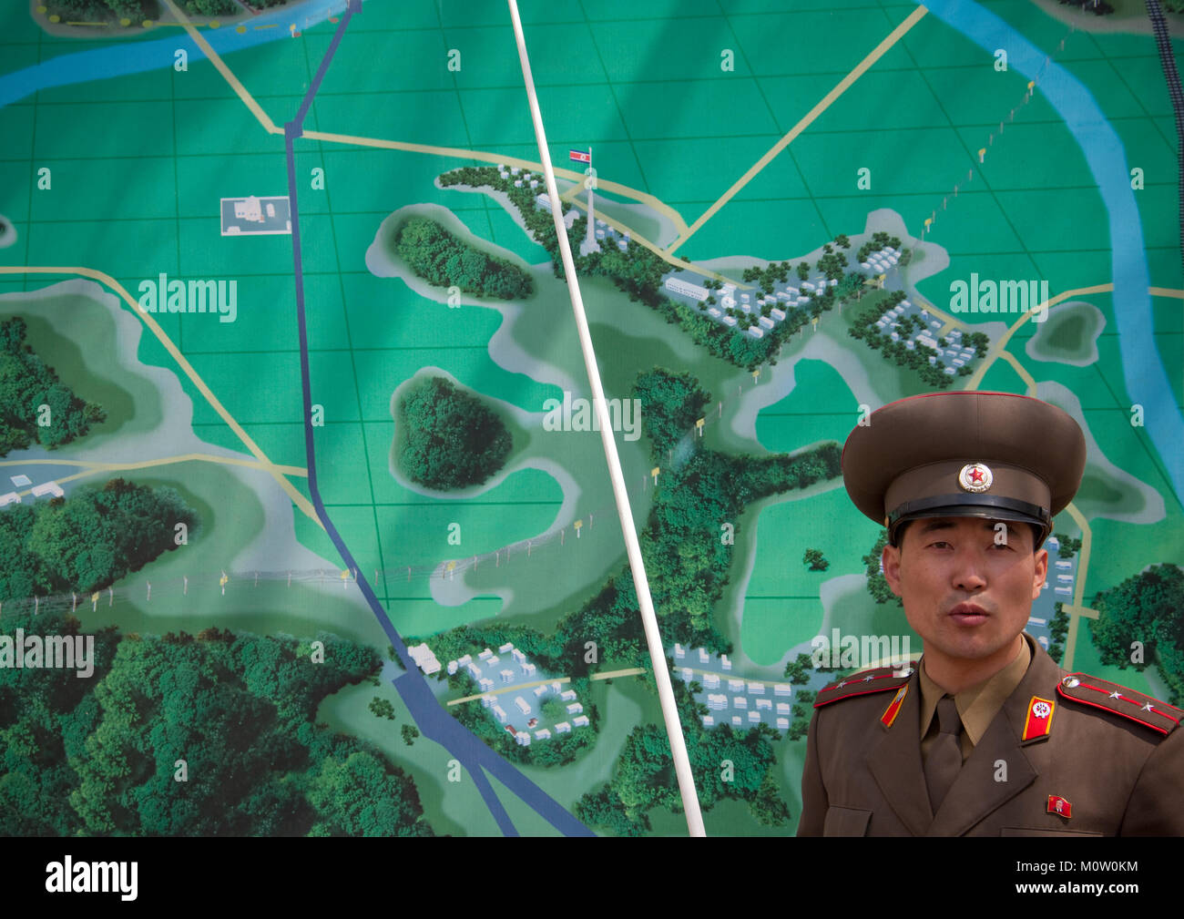North Korean soldier in the joint security area in front of the map of ...